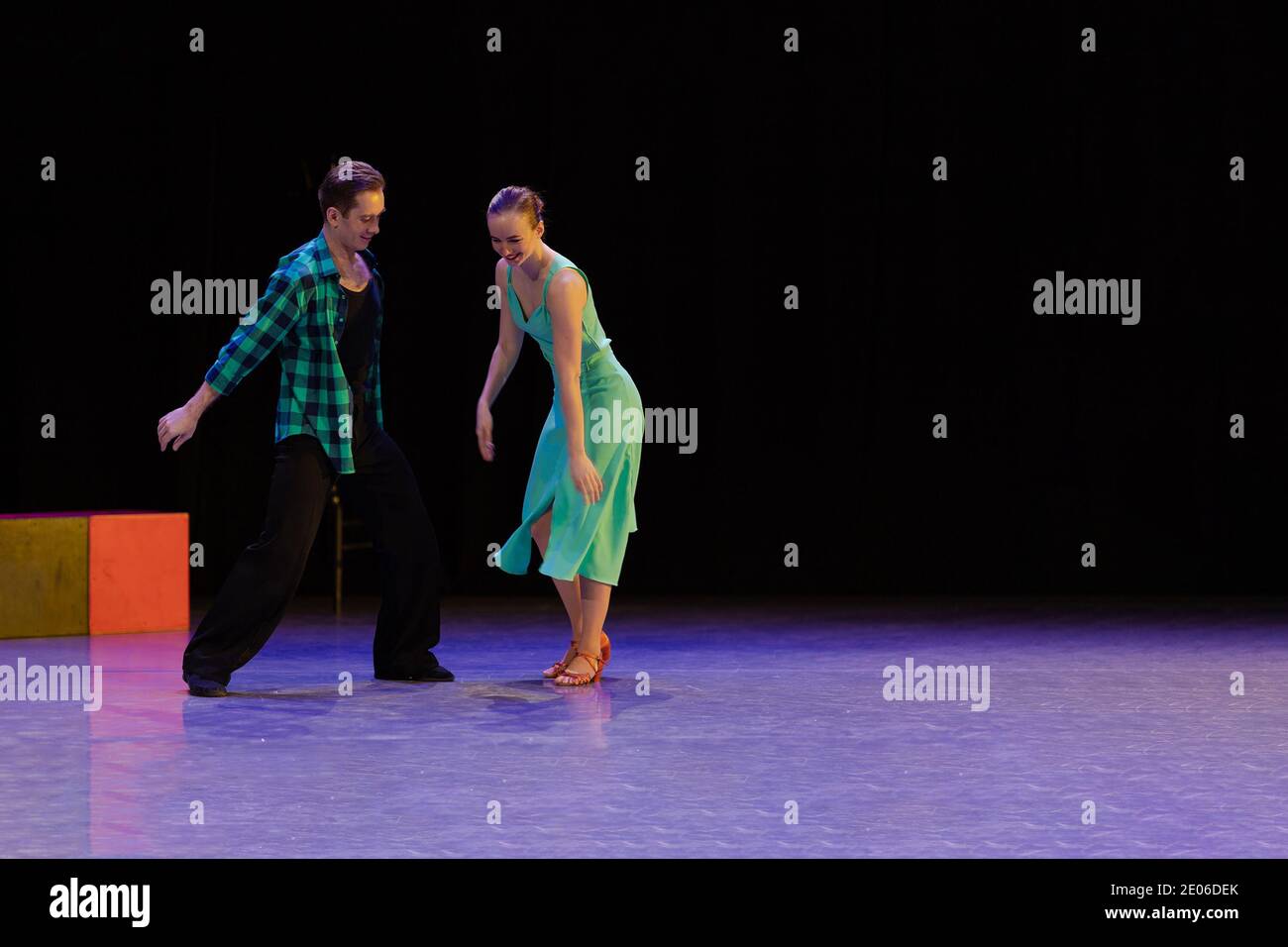 dancers a man and a woman perform in a theater on stage in a dance ...