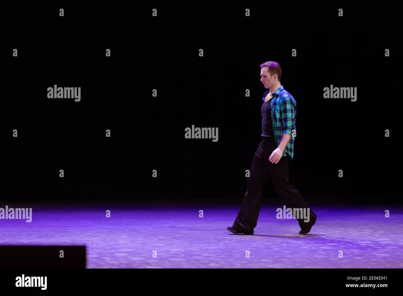Actor dancer young man performs in the theater on stage in a dance ...