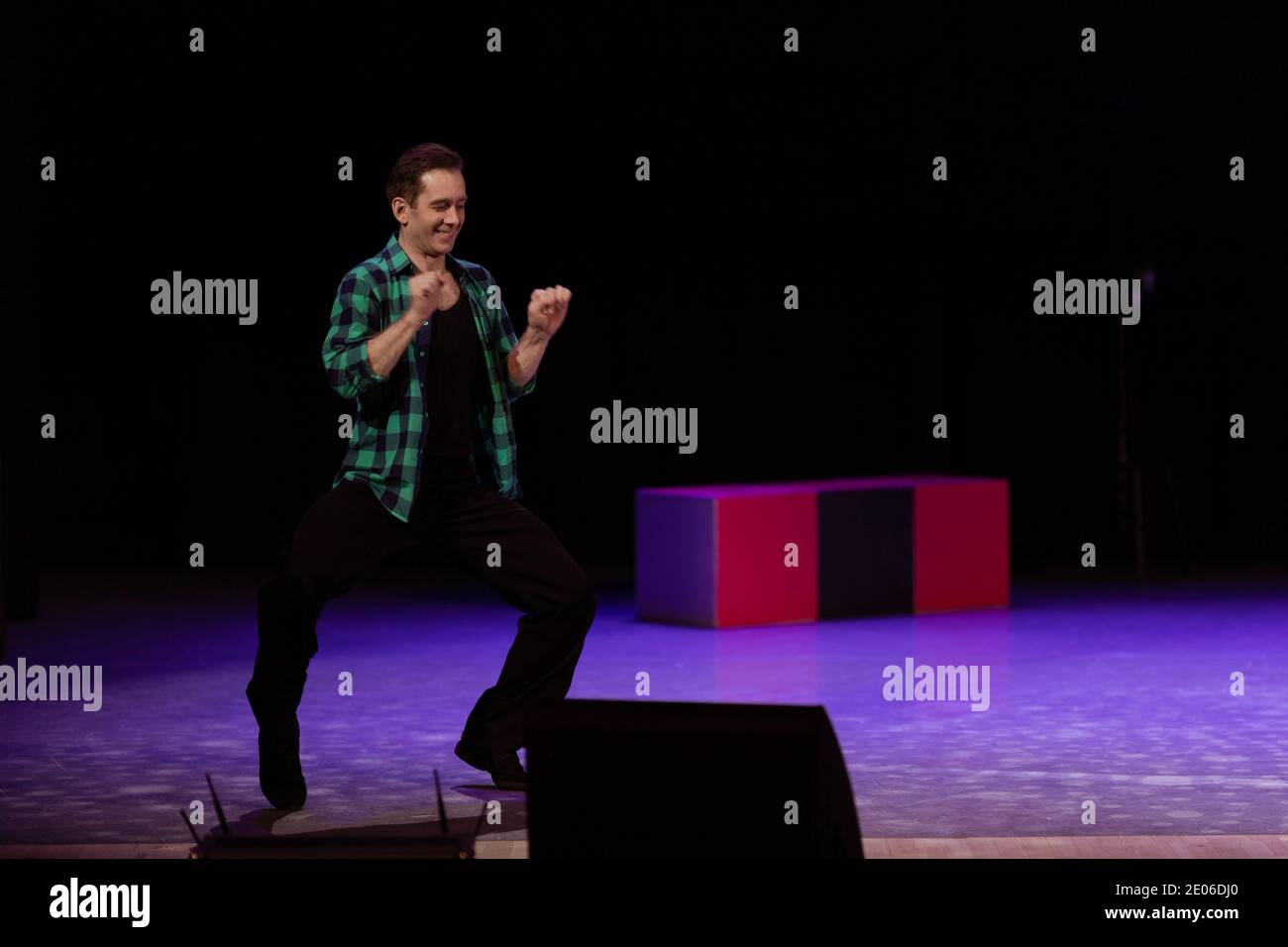 Actor dancer young man performs in the theater on stage in a dance ...