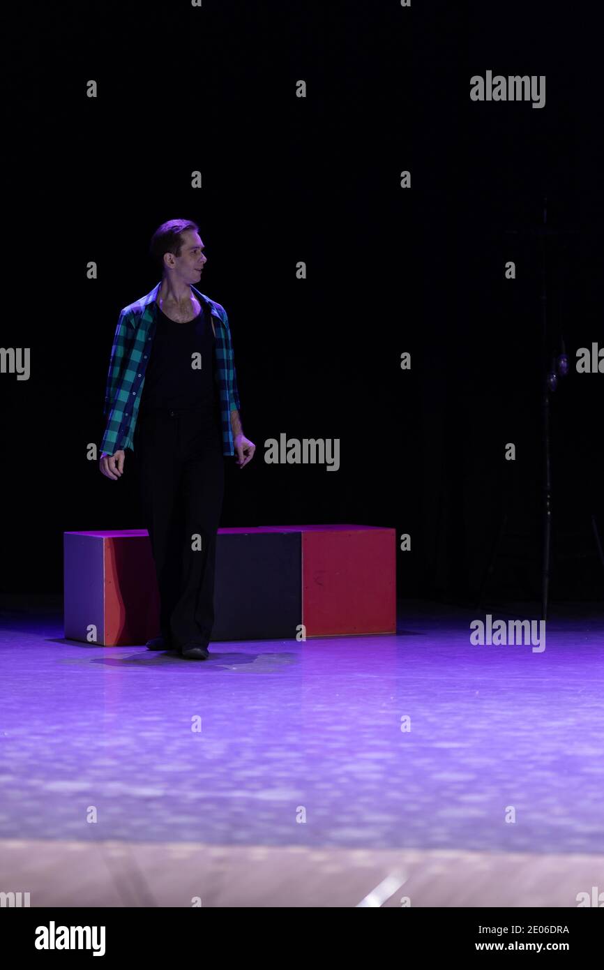 Actor dancer young man performs in the theater on stage in a dance ...