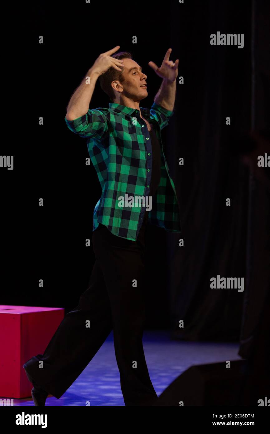 Actor dancer young man performs in the theater on stage in a dance ...