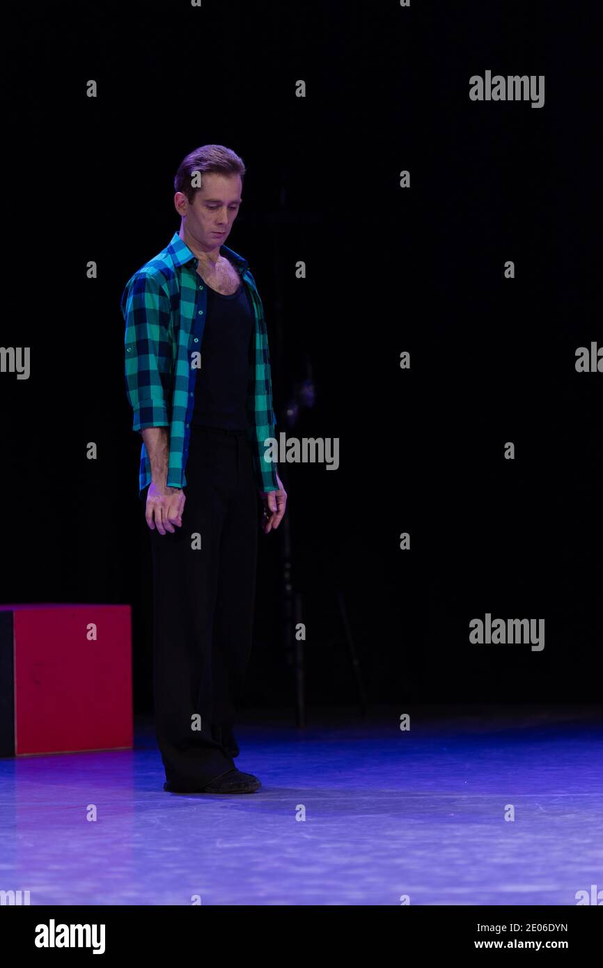 Actor dancer young man performs in the theater on stage in a dance ...