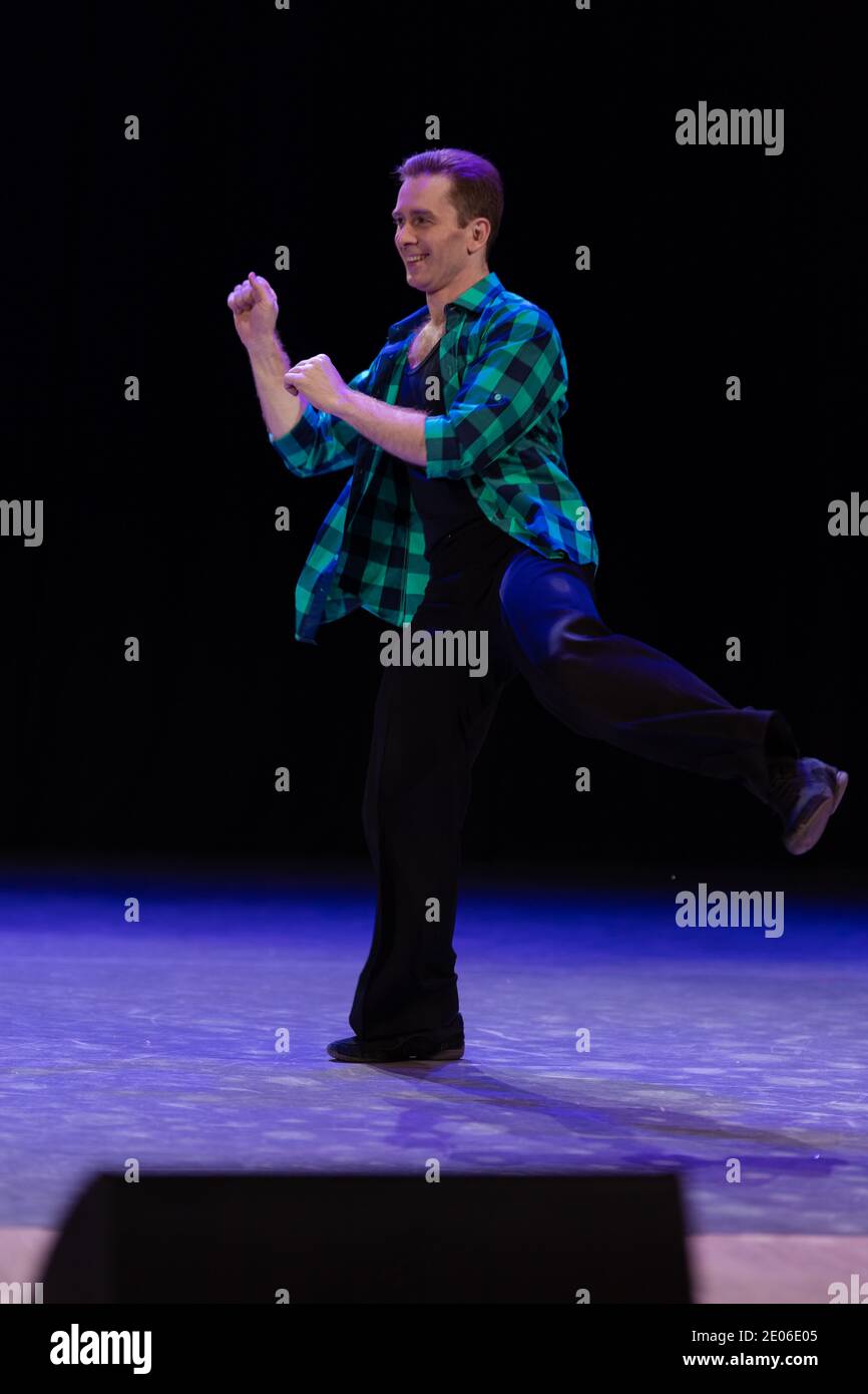 Actor dancer young man performs in the theater on stage in a dance ...