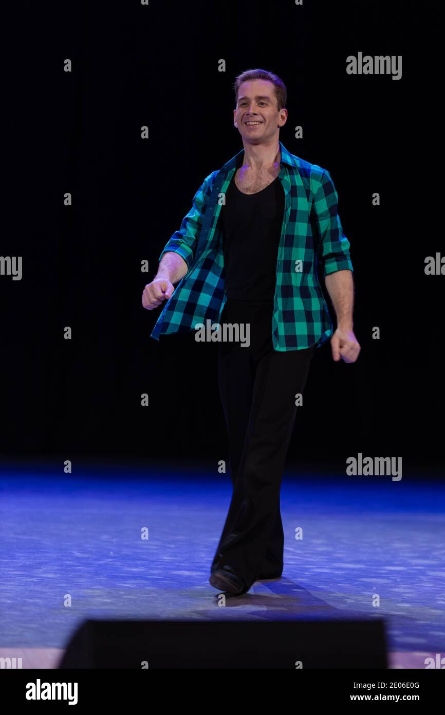 Actor dancer young man performs in the theater on stage in a dance ...