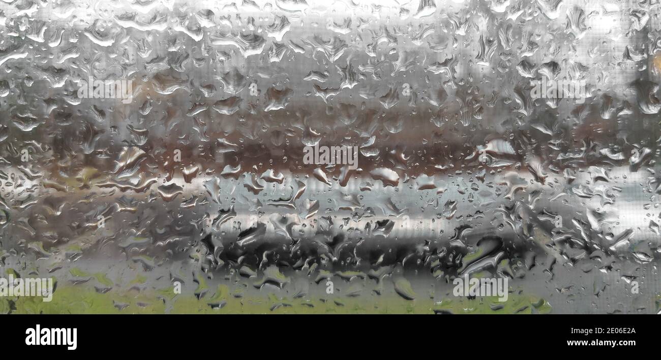Raindrops flowing on window hi-res stock photography and images - Alamy