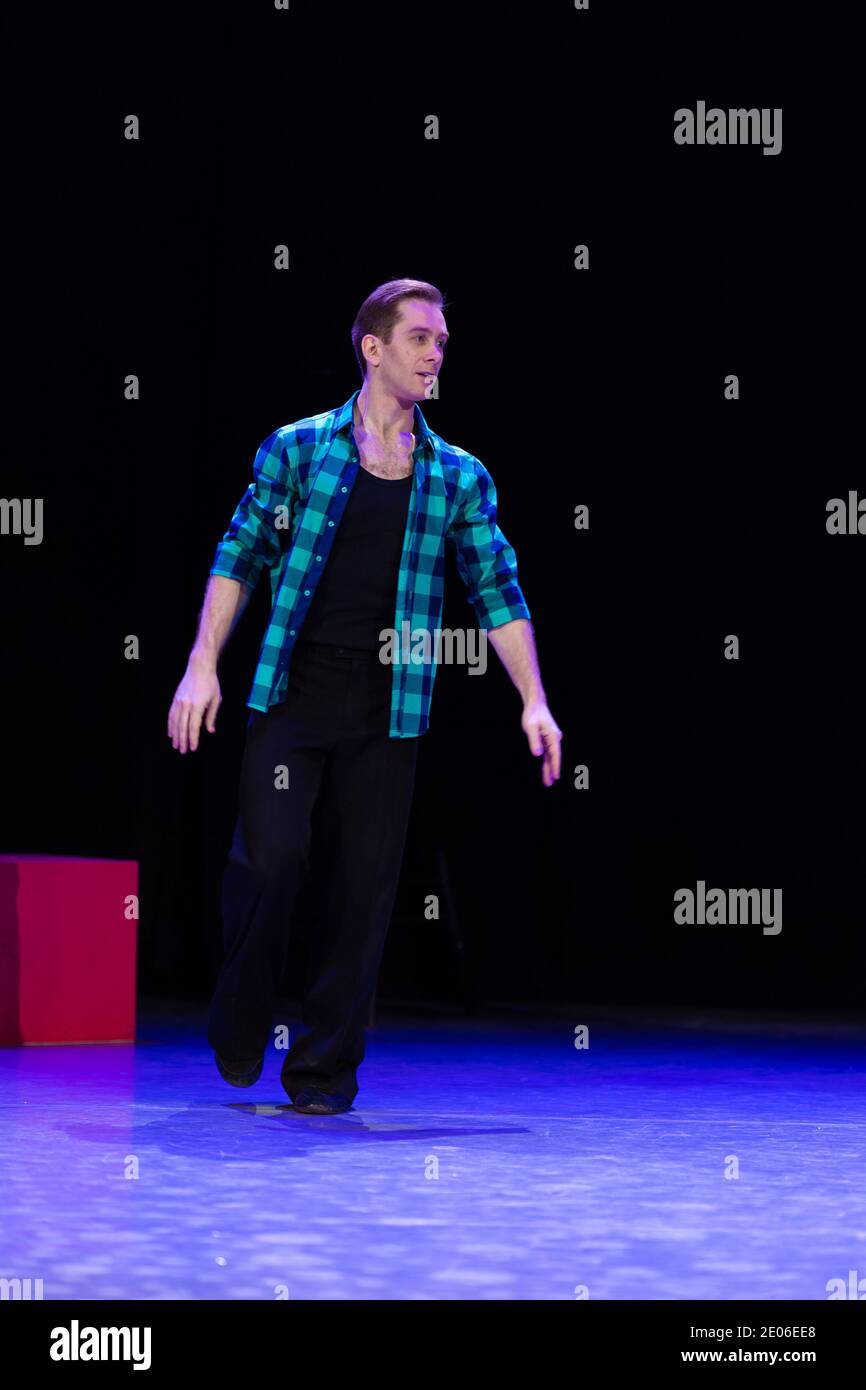 Actor dancer young man performs in the theater on stage in a dance ...