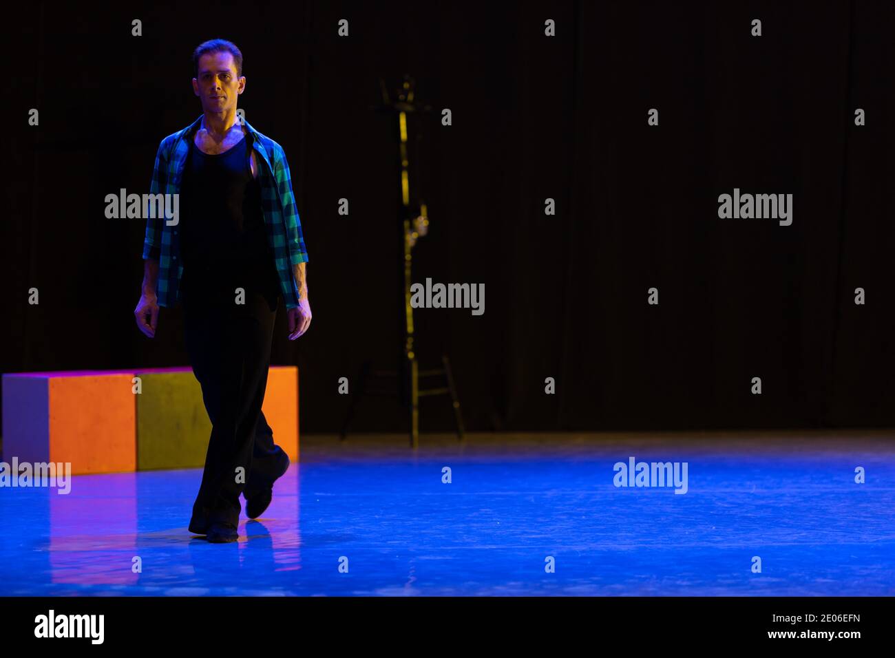 Actor dancer young man performs in the theater on stage in a dance ...