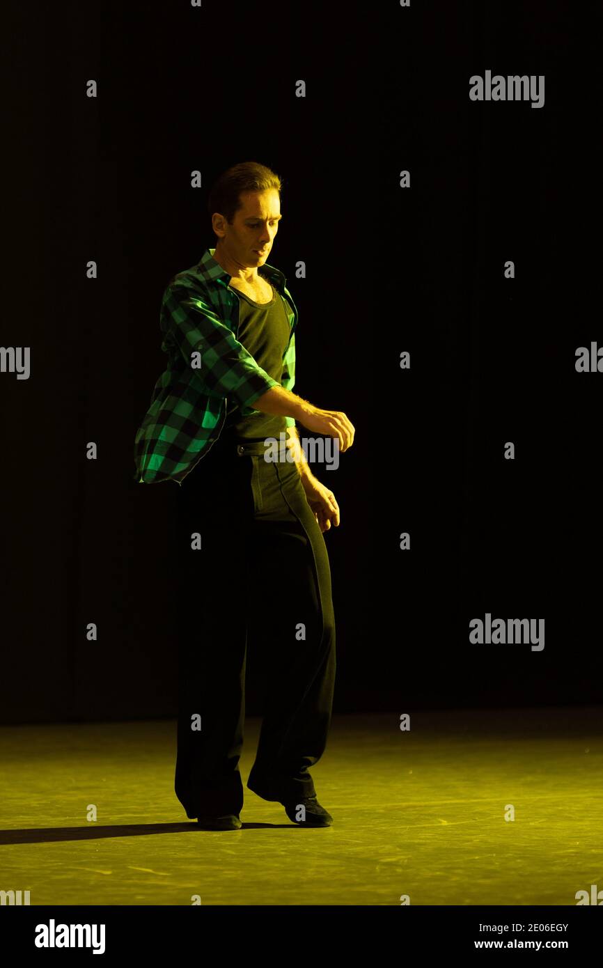 Actor dancer young man performs in the theater on stage in a dance ...