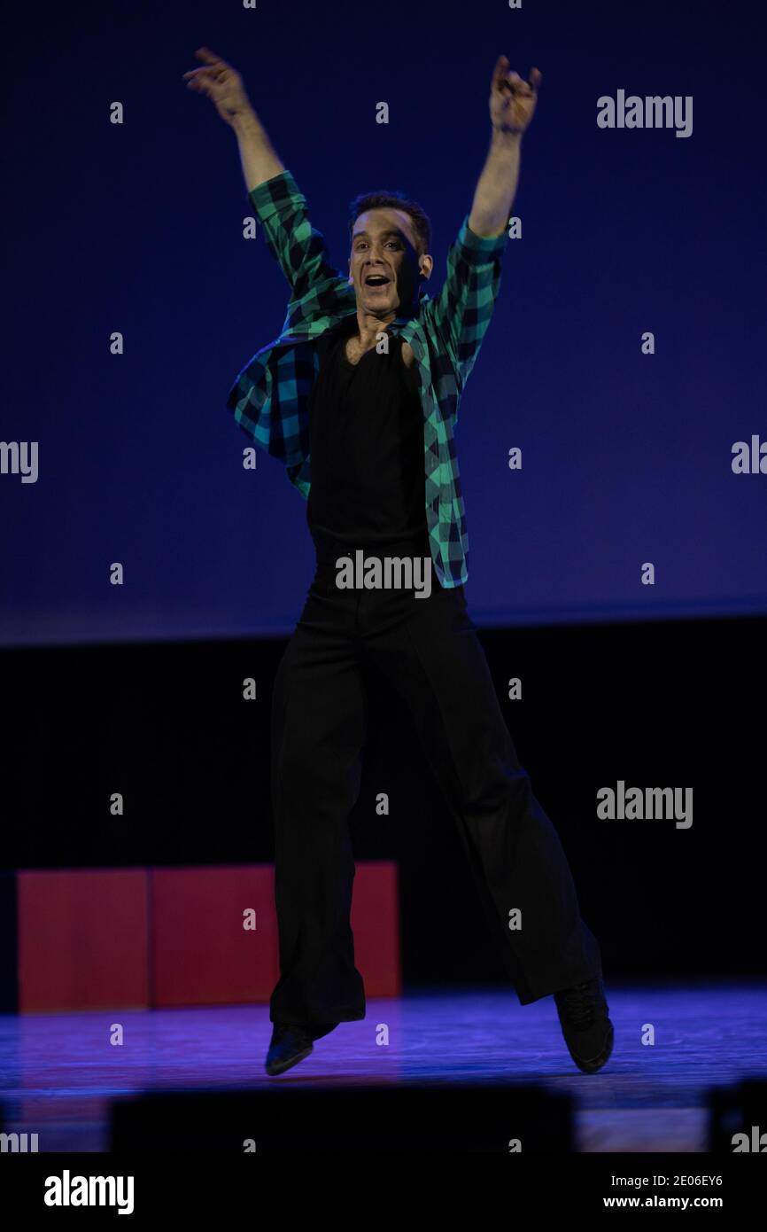 Actor dancer young man performs in the theater on stage in a dance ...