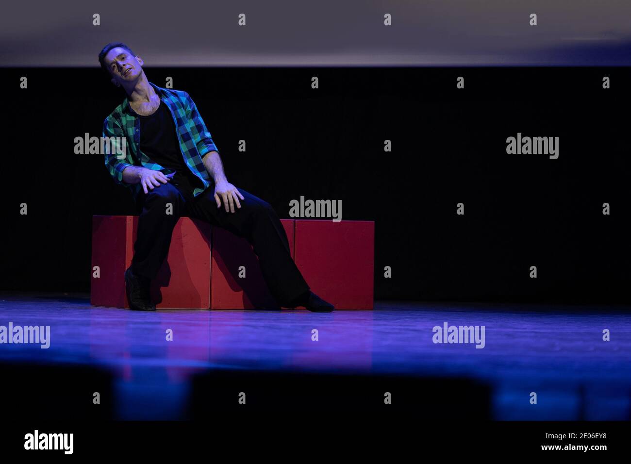 Actor dancer young man performs in the theater on stage in a dance ...