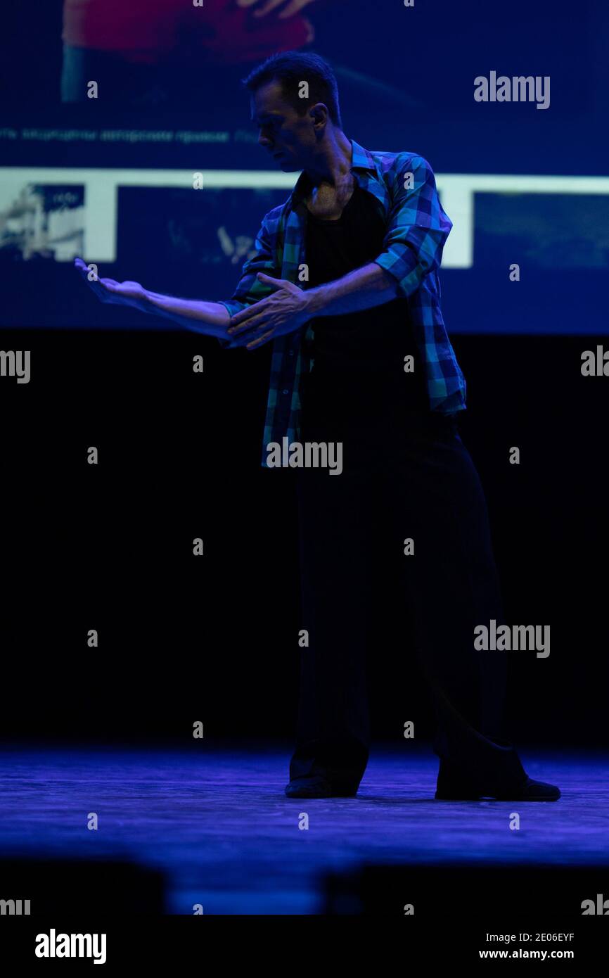Actor dancer young man performs in the theater on stage in a dance ...