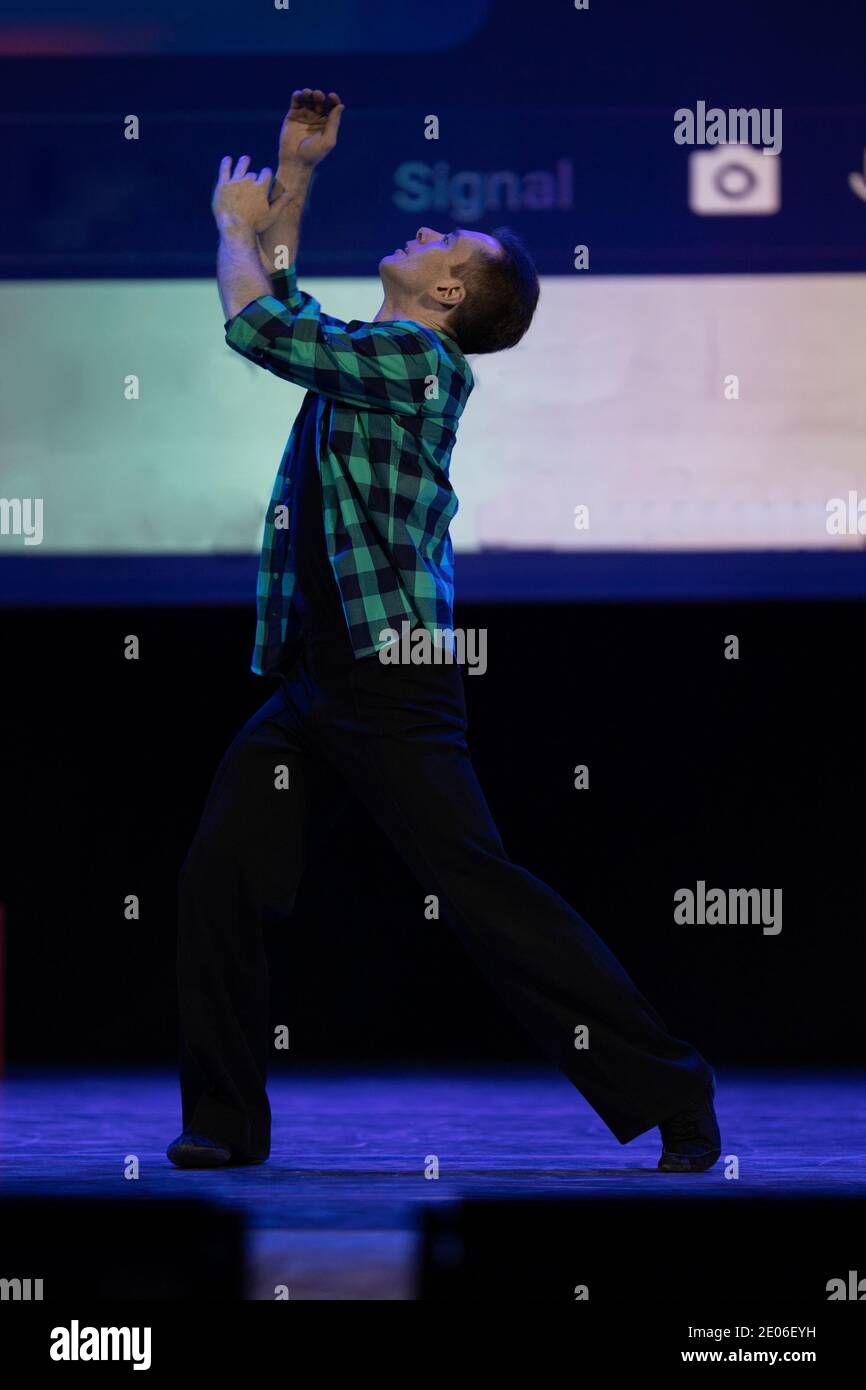 Actor dancer young man performs in the theater on stage in a dance ...