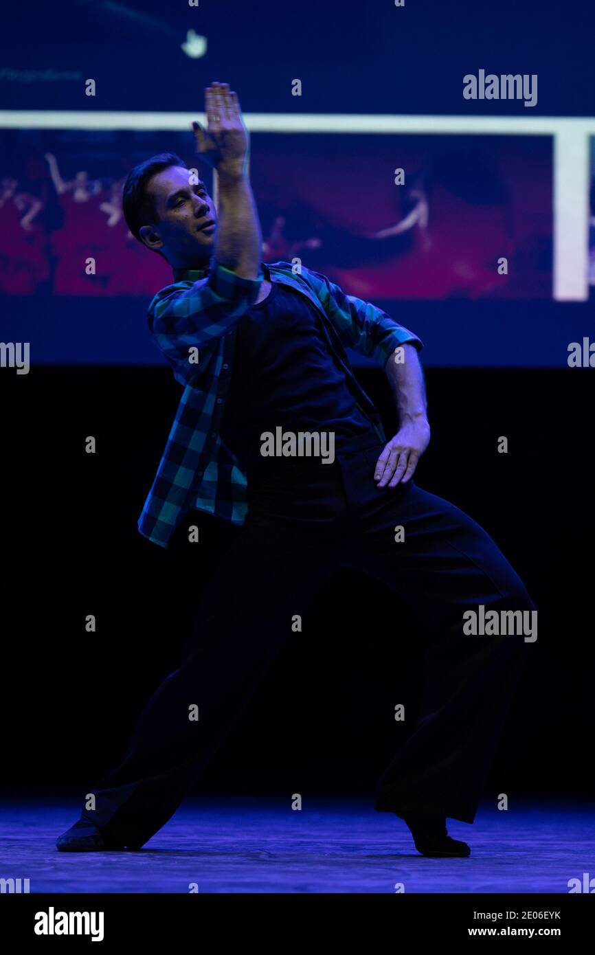 Actor dancer young man performs in the theater on stage in a dance ...