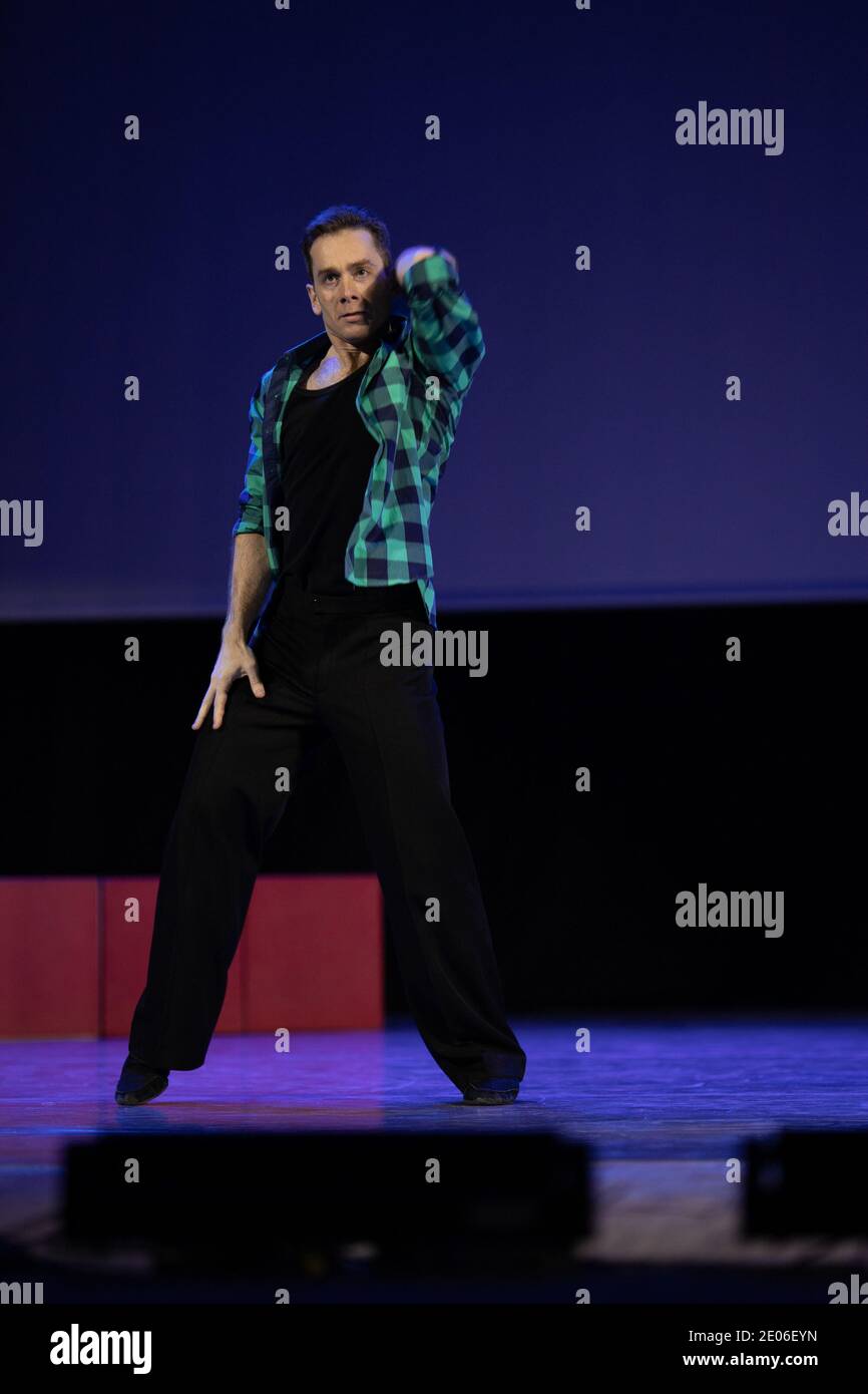 Actor dancer young man performs in the theater on stage in a dance ...