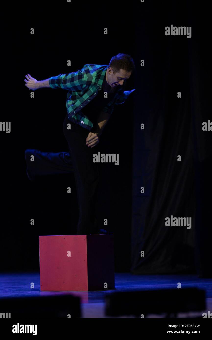 Actor dancer young man performs in the theater on stage in a dance ...