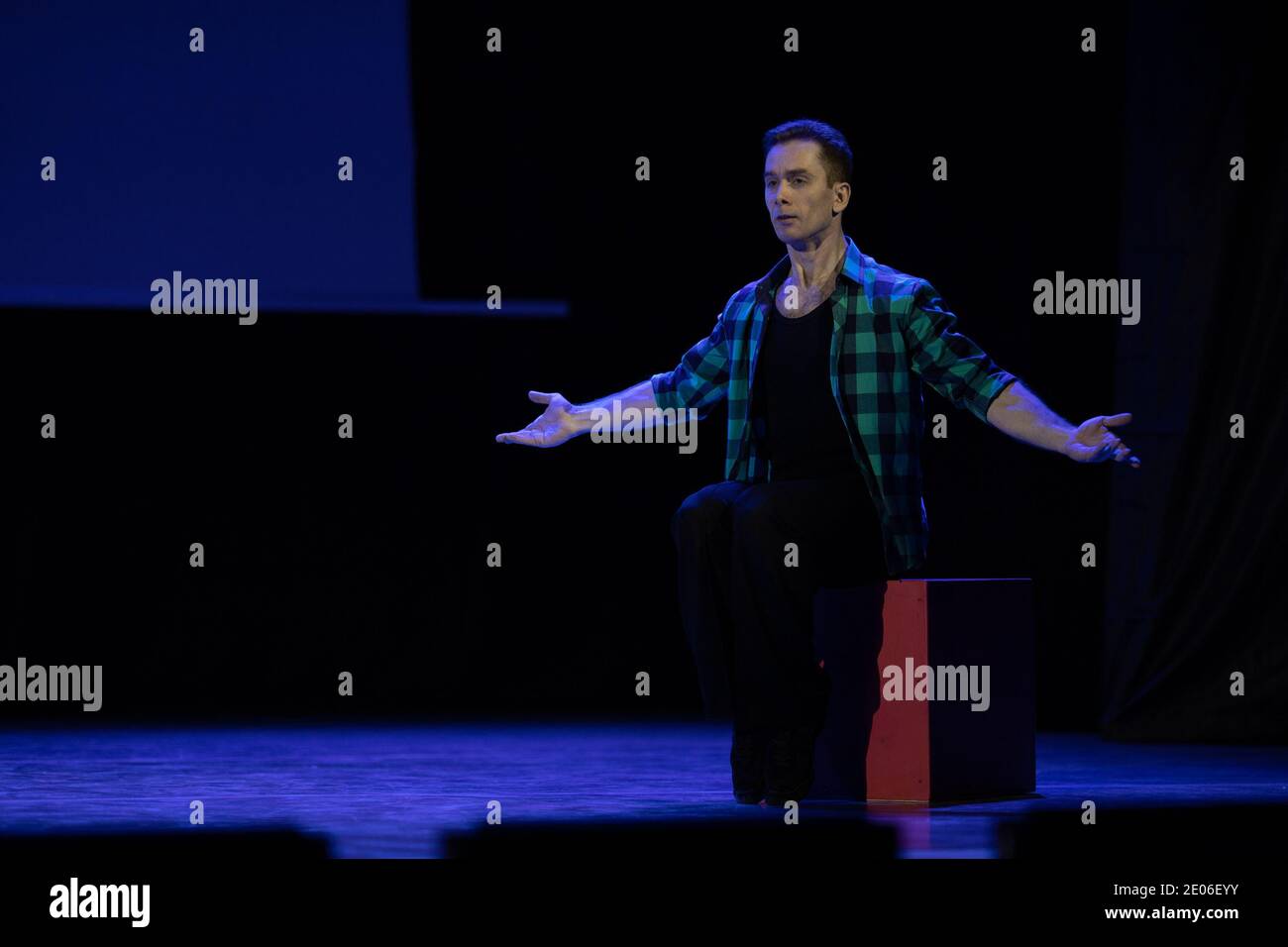 Actor dancer young man performs in the theater on stage in a dance ...