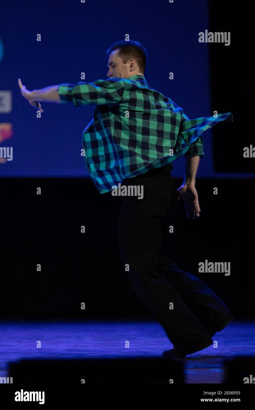 Actor dancer young man performs in the theater on stage in a dance ...
