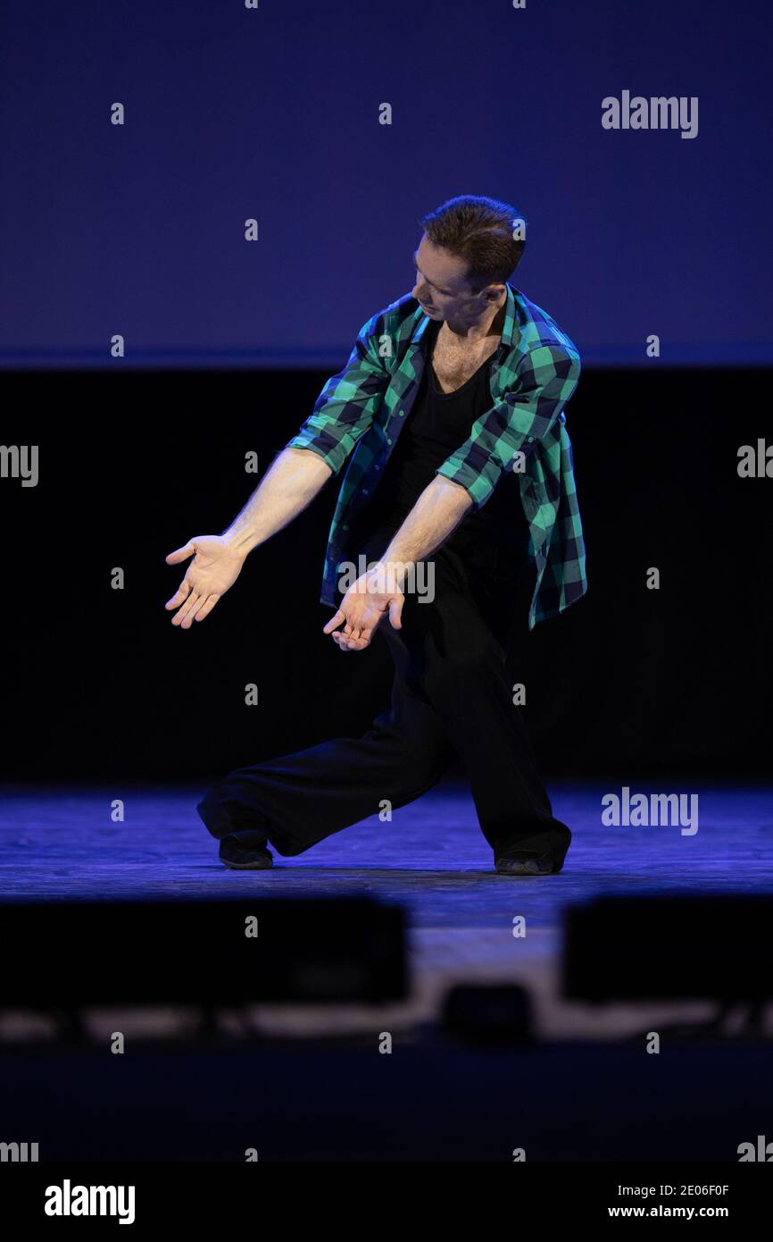 Actor dancer young man performs in the theater on stage in a dance ...