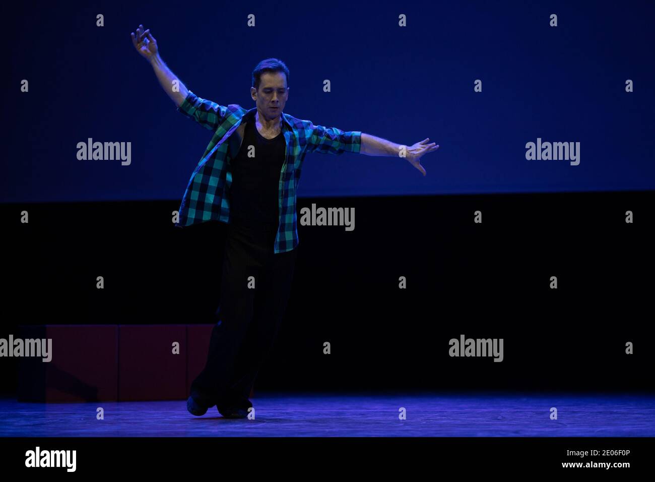 Actor dancer young man performs in the theater on stage in a dance ...