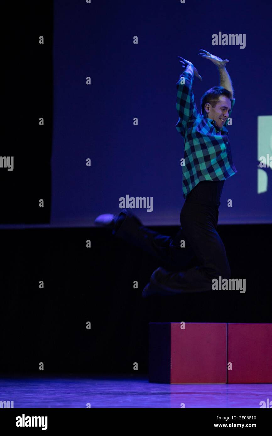 Actor dancer young man performs in the theater on stage in a dance ...