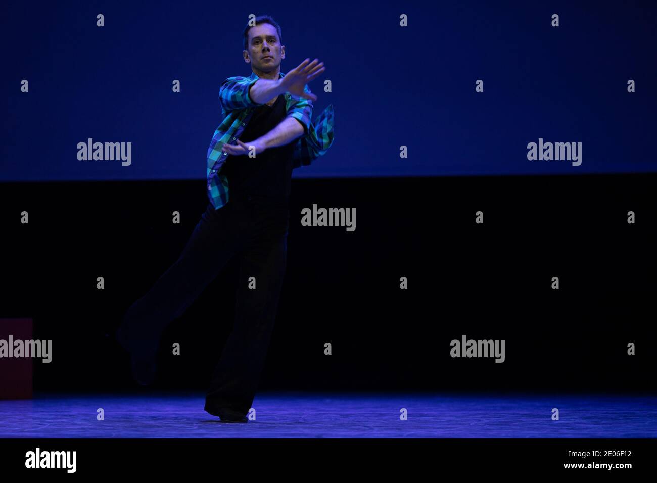 Actor dancer young man performs in the theater on stage in a dance ...