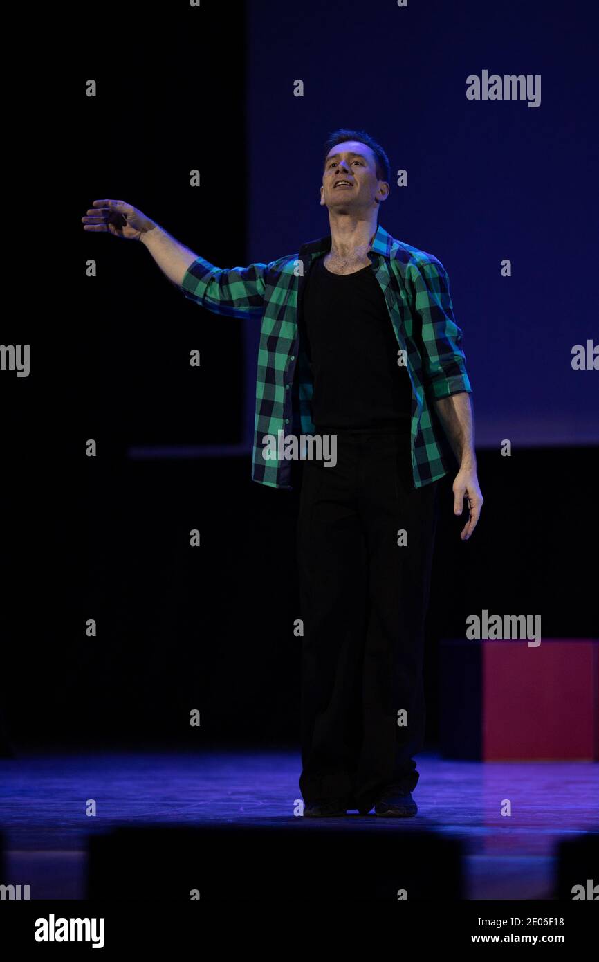 Actor dancer young man performs in the theater on stage in a dance ...
