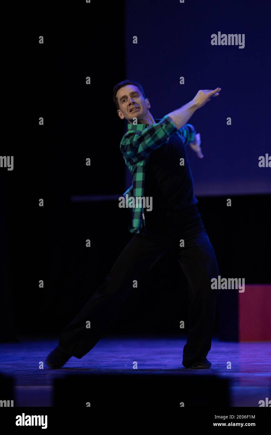 Actor dancer young man performs in the theater on stage in a dance ...