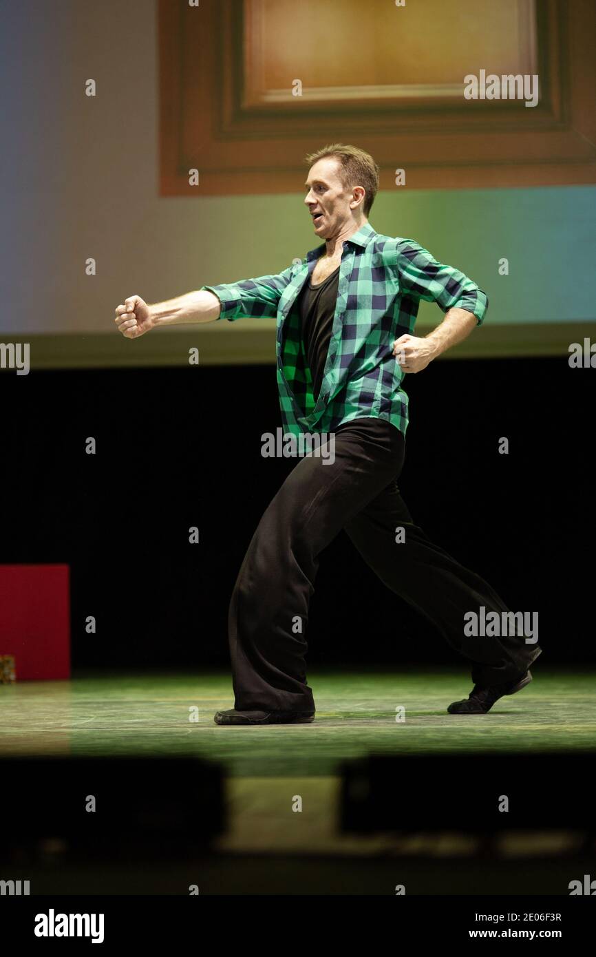 Actor dancer young man performs in the theater on stage in a dance ...