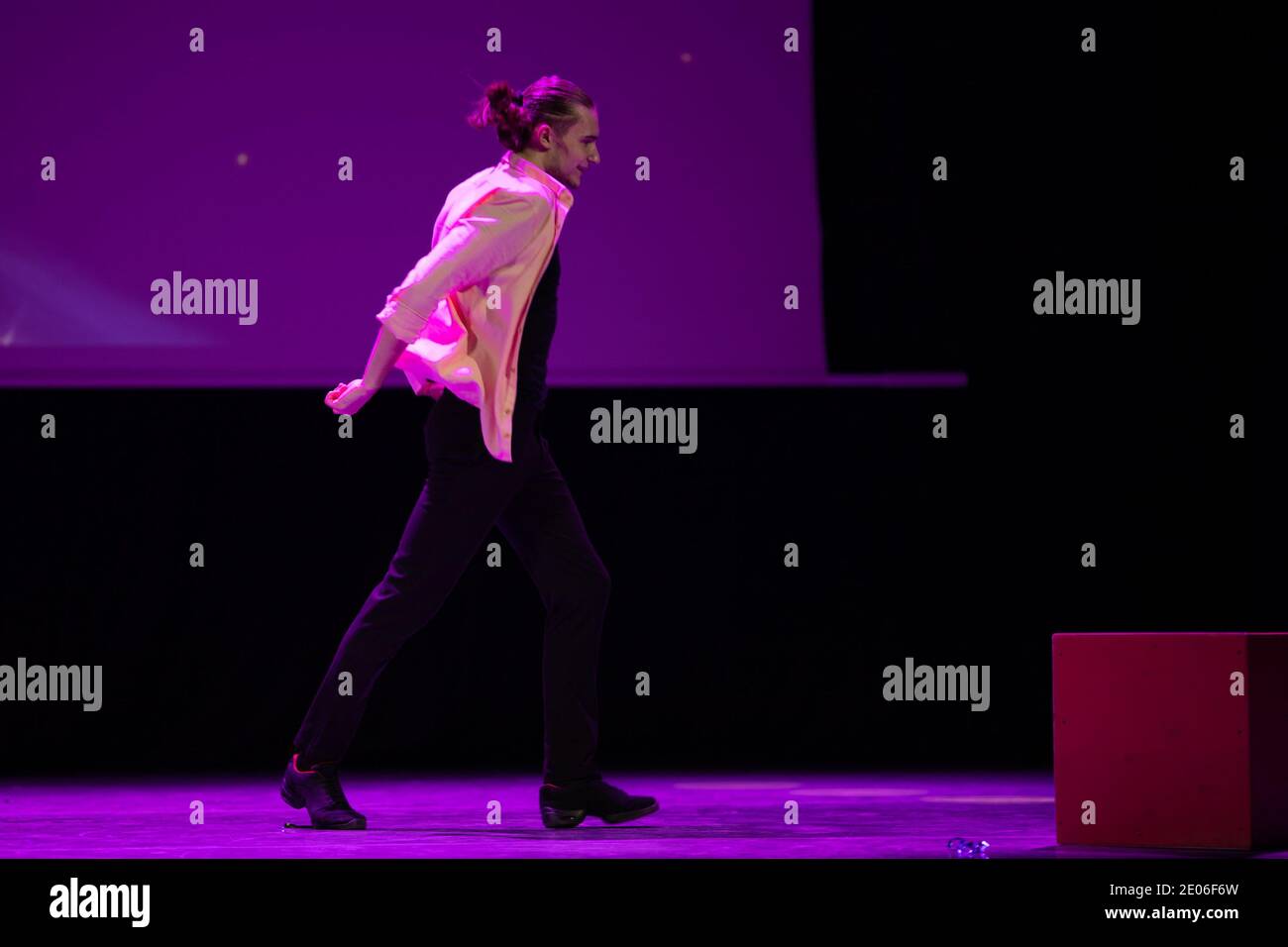 Actor dancer young man performs in the theater on stage in a dance ...