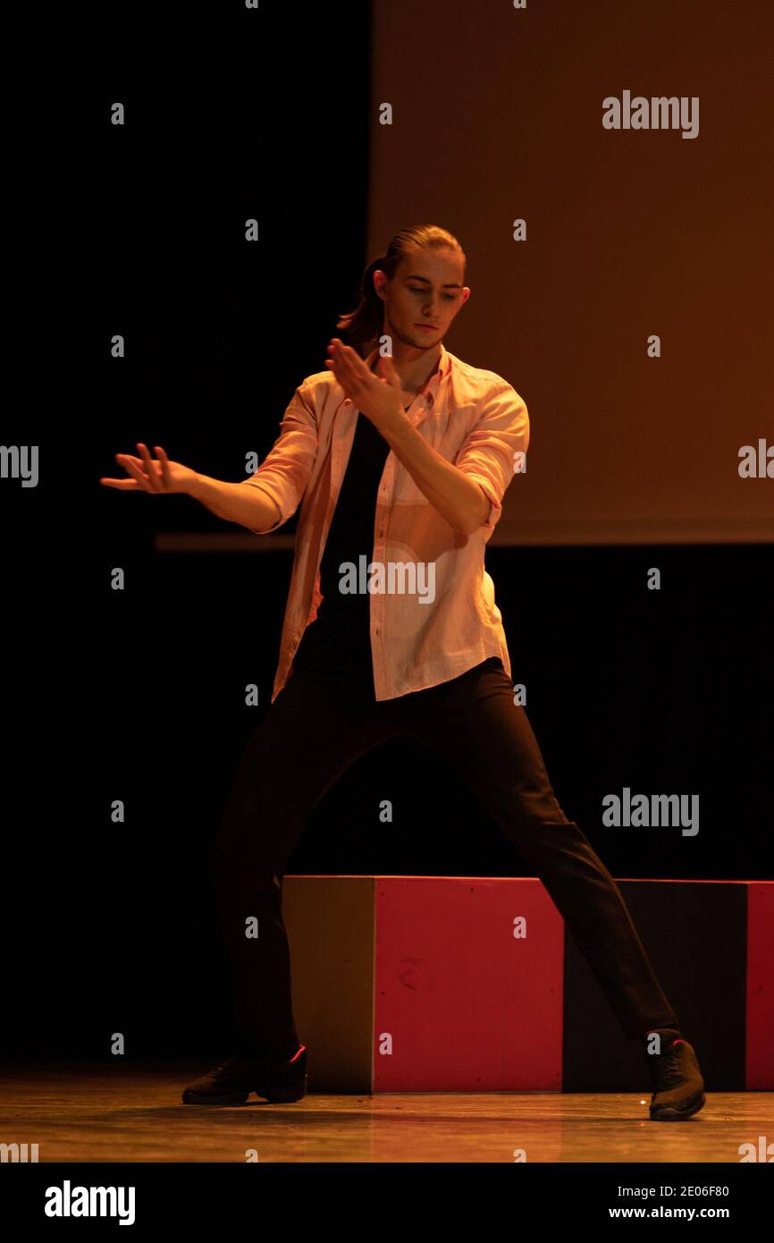 Actor dancer young man performs in the theater on stage in a dance ...