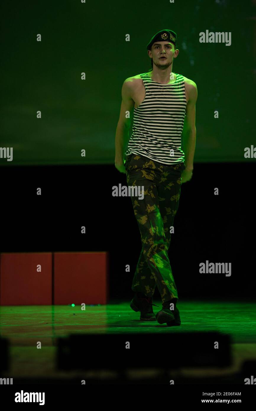 Actor dancer young man performs in the theater on stage in a dance ...