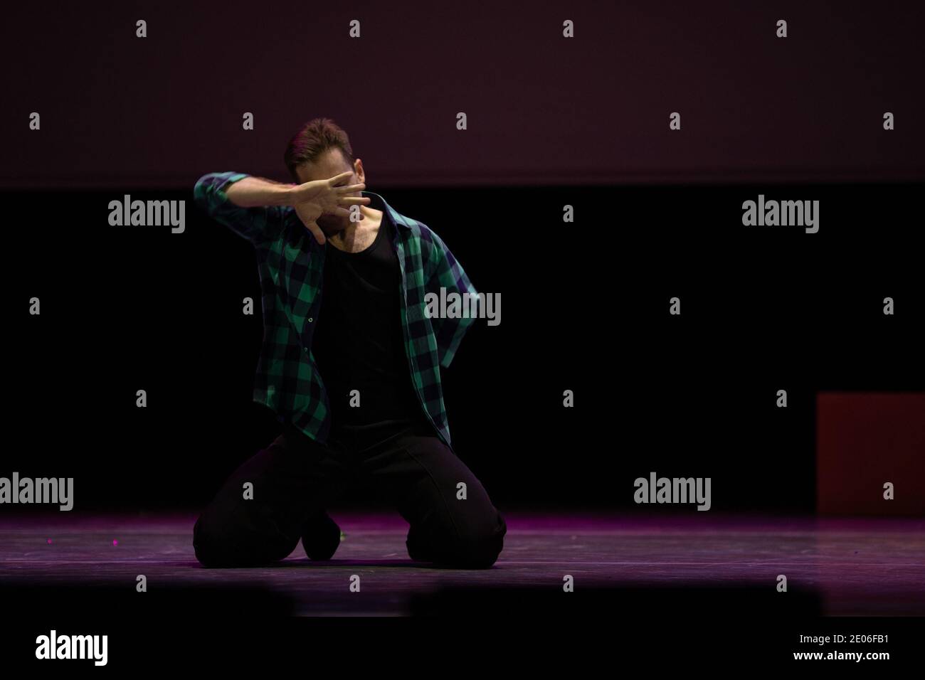 Actor dancer young man performs in the theater on stage in a dance ...