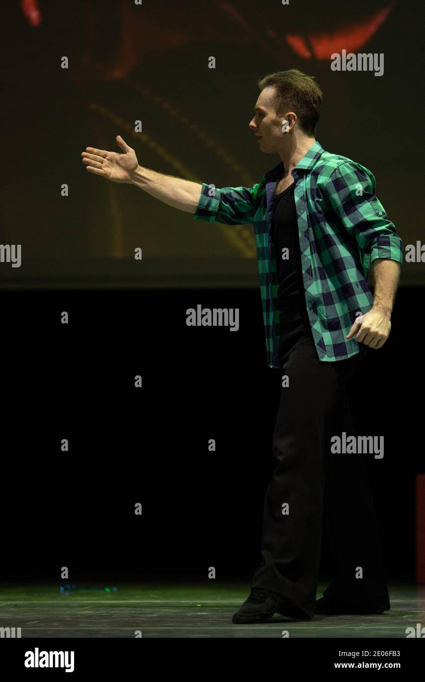 Actor dancer young man performs in the theater on stage in a dance ...