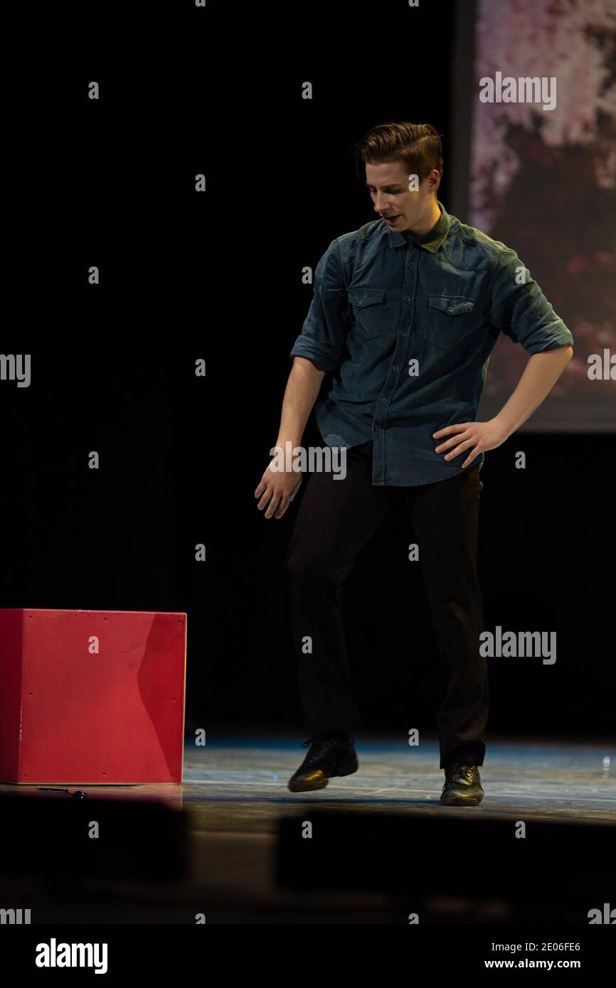 Actor dancer young man performs in the theater on stage in a dance ...