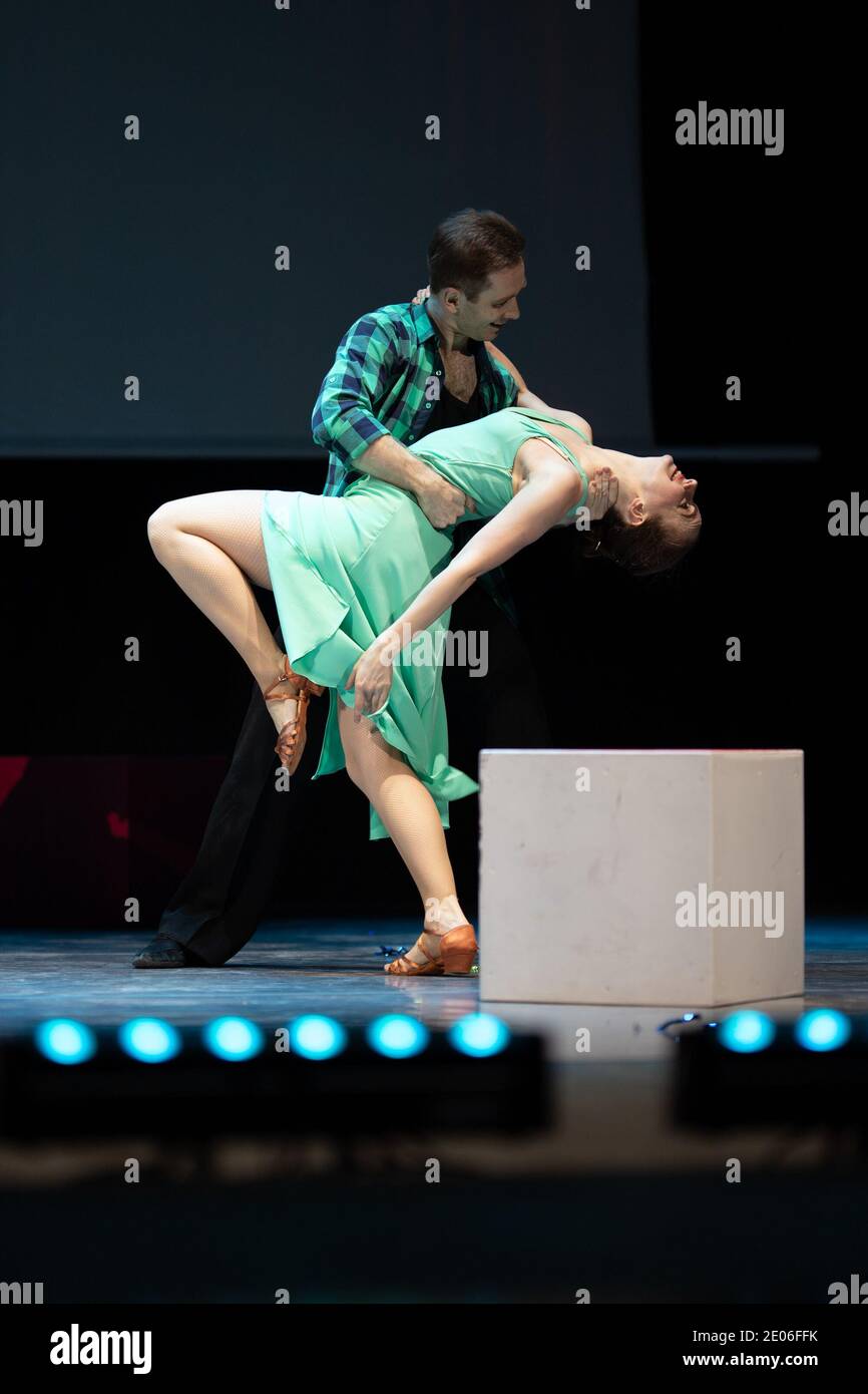 Team Actors dancers perform in the theater on stage in a retro musical ...