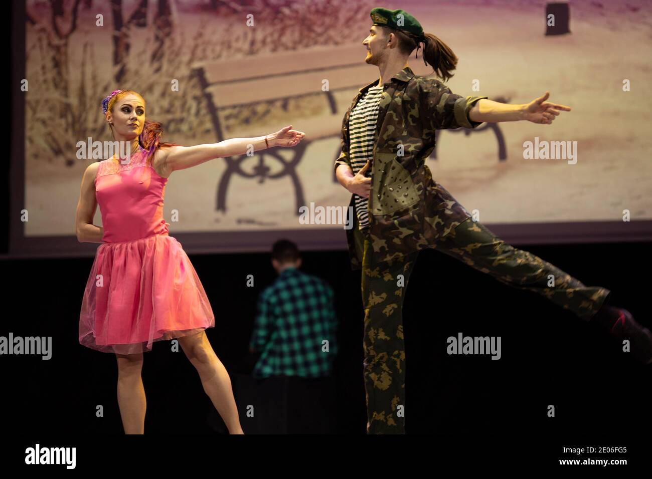 Team Actors dancers perform in the theater on stage in a retro musical ...