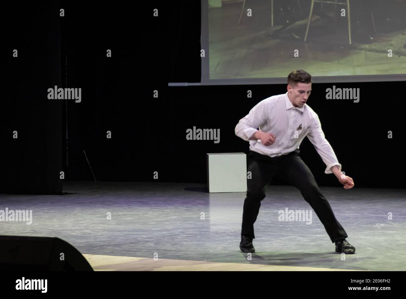 Actor dancer young man performs in the theater on stage in a dance ...