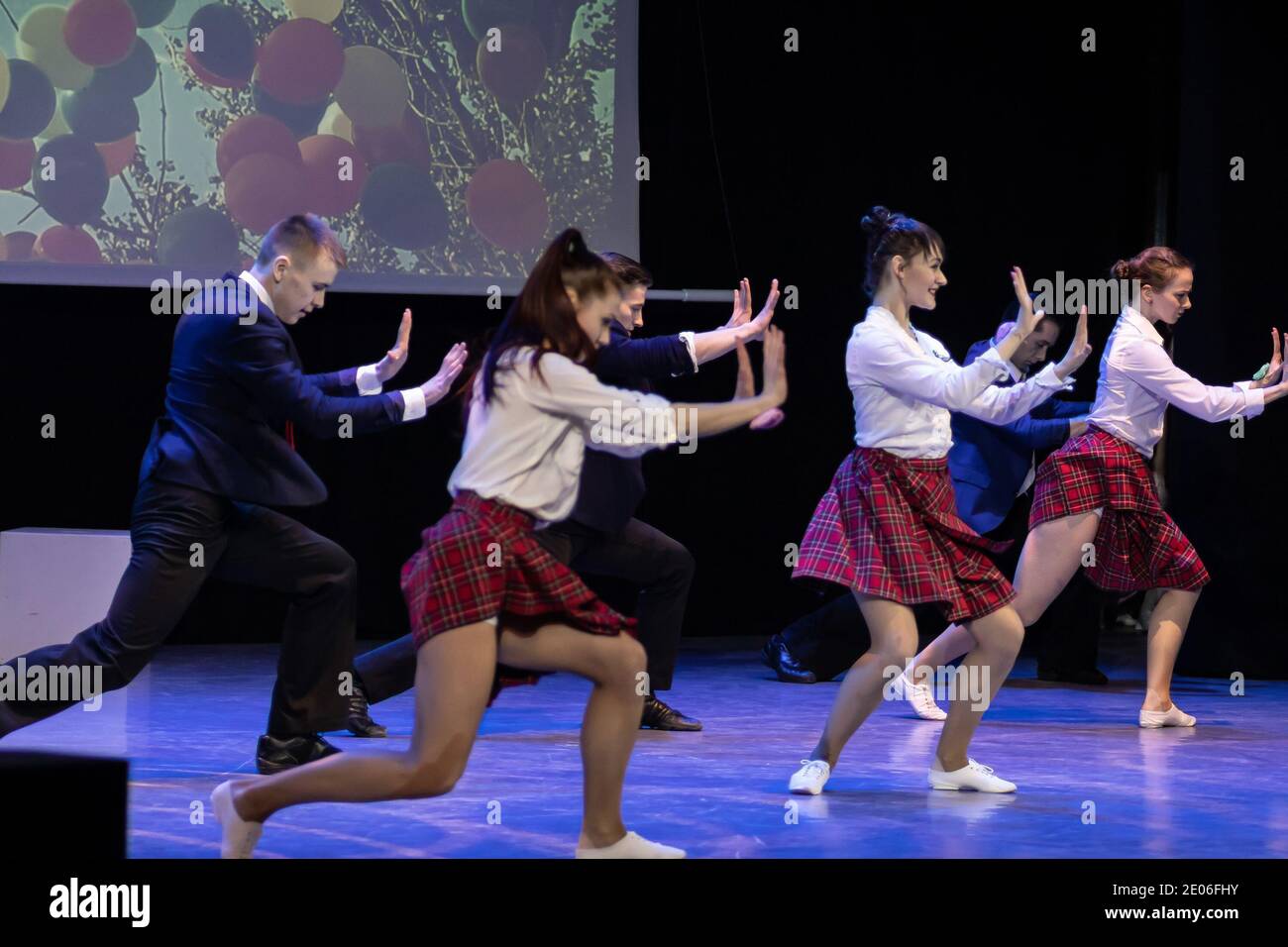 Team Actors dancers perform in the theater on stage in a retro musical ...