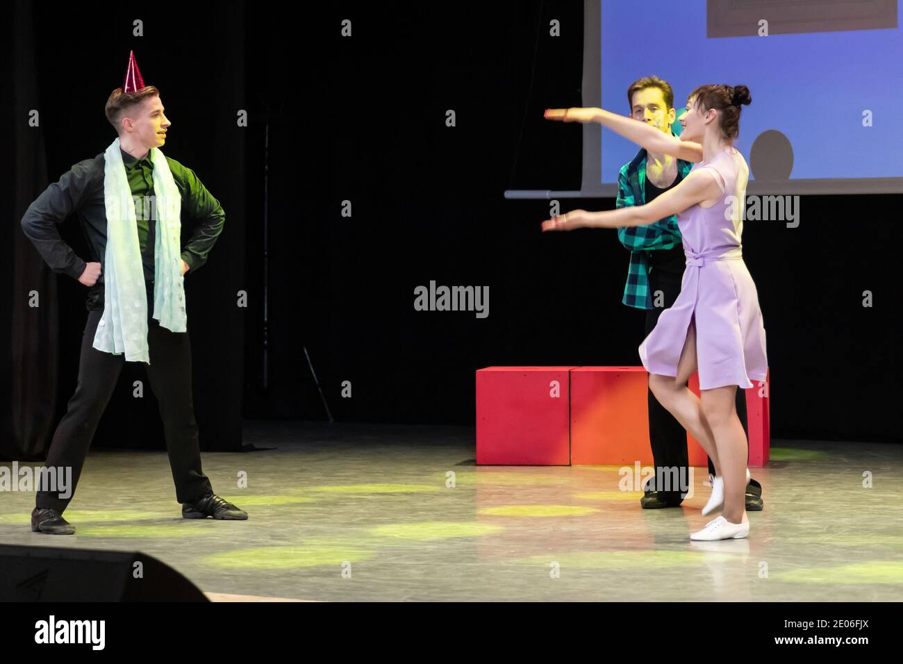 Team Actors dancers perform in the theater on stage in a retro musical ...