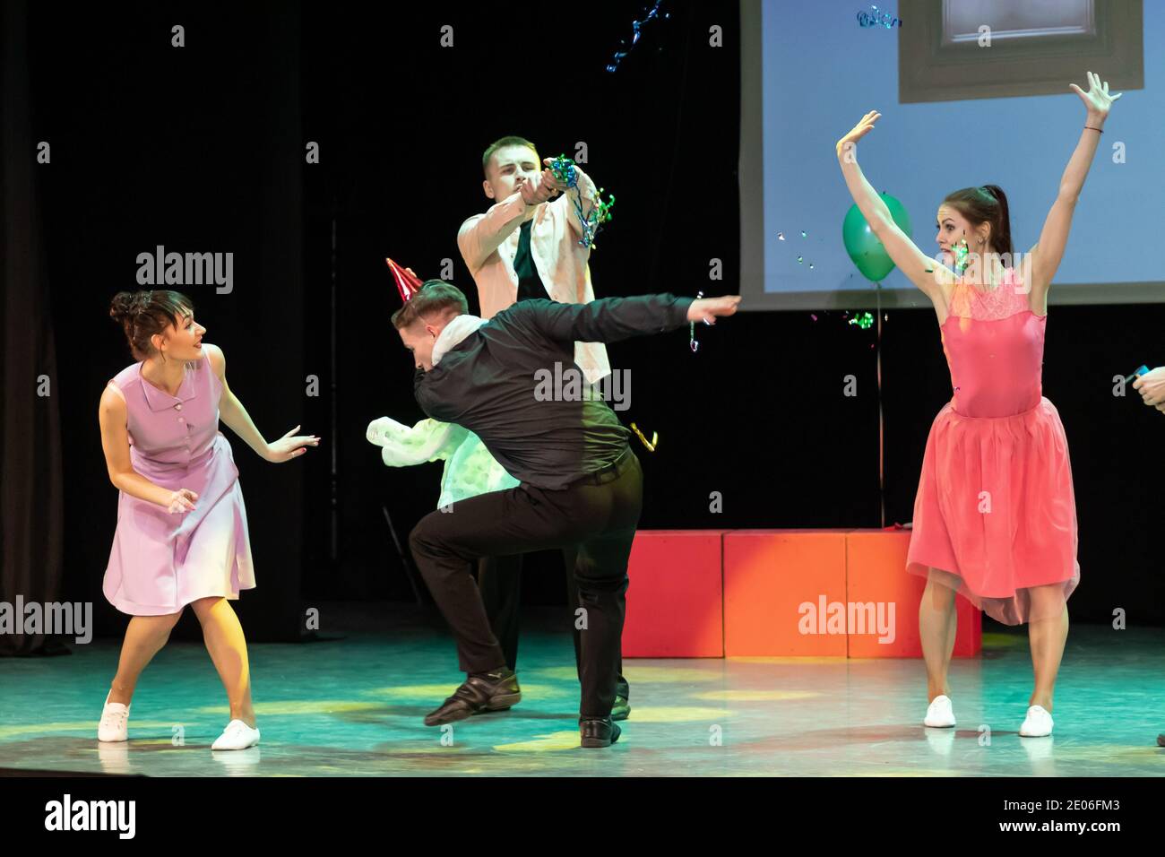 Team Actors dancers perform in the theater on stage in a retro musical ...