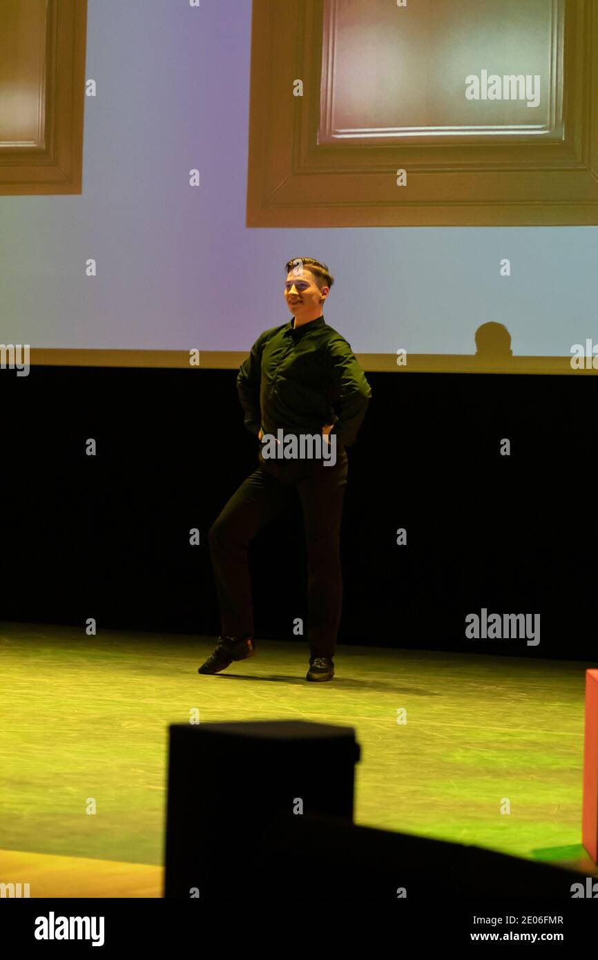Actor dancer young man performs in the theater on stage in a dance ...