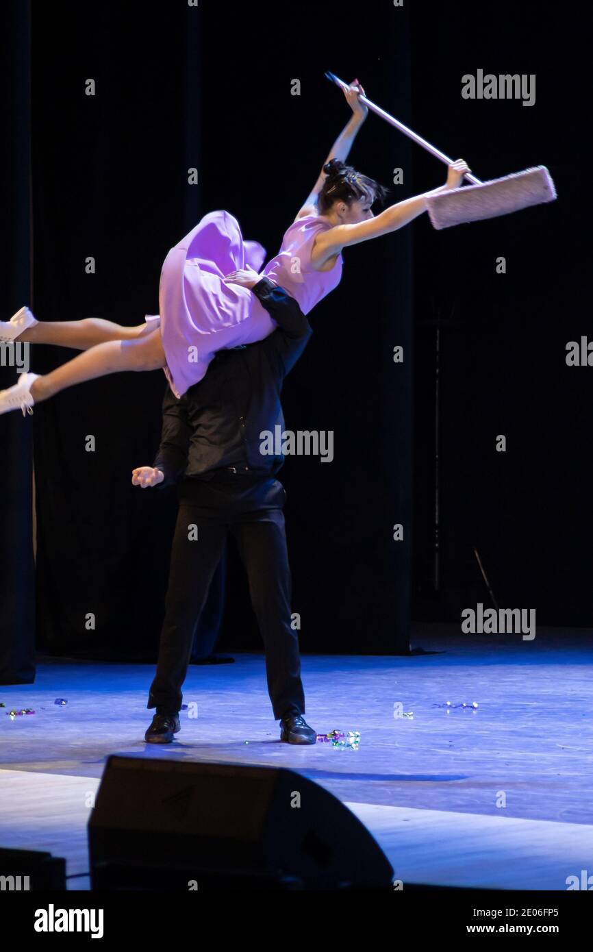 Team Actors dancers perform in the theater on stage in a retro musical ...