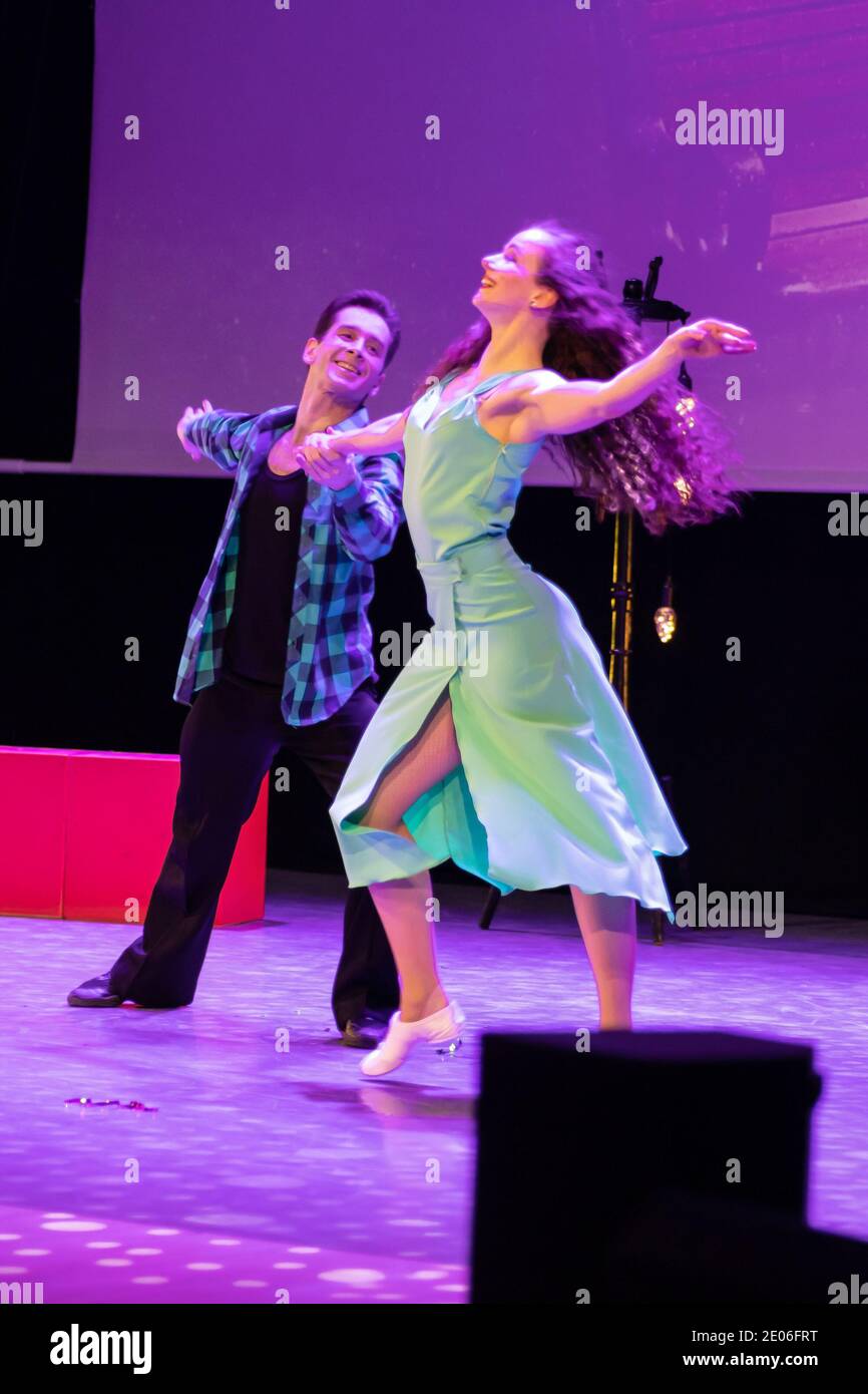 Team Actors dancers perform in the theater on stage in a retro musical ...