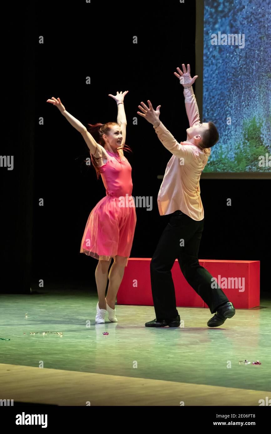Team Actors dancers perform in the theater on stage in a retro musical ...
