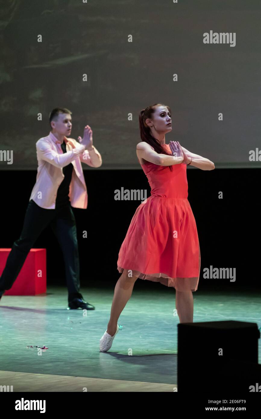 Team Actors dancers perform in the theater on stage in a retro musical ...