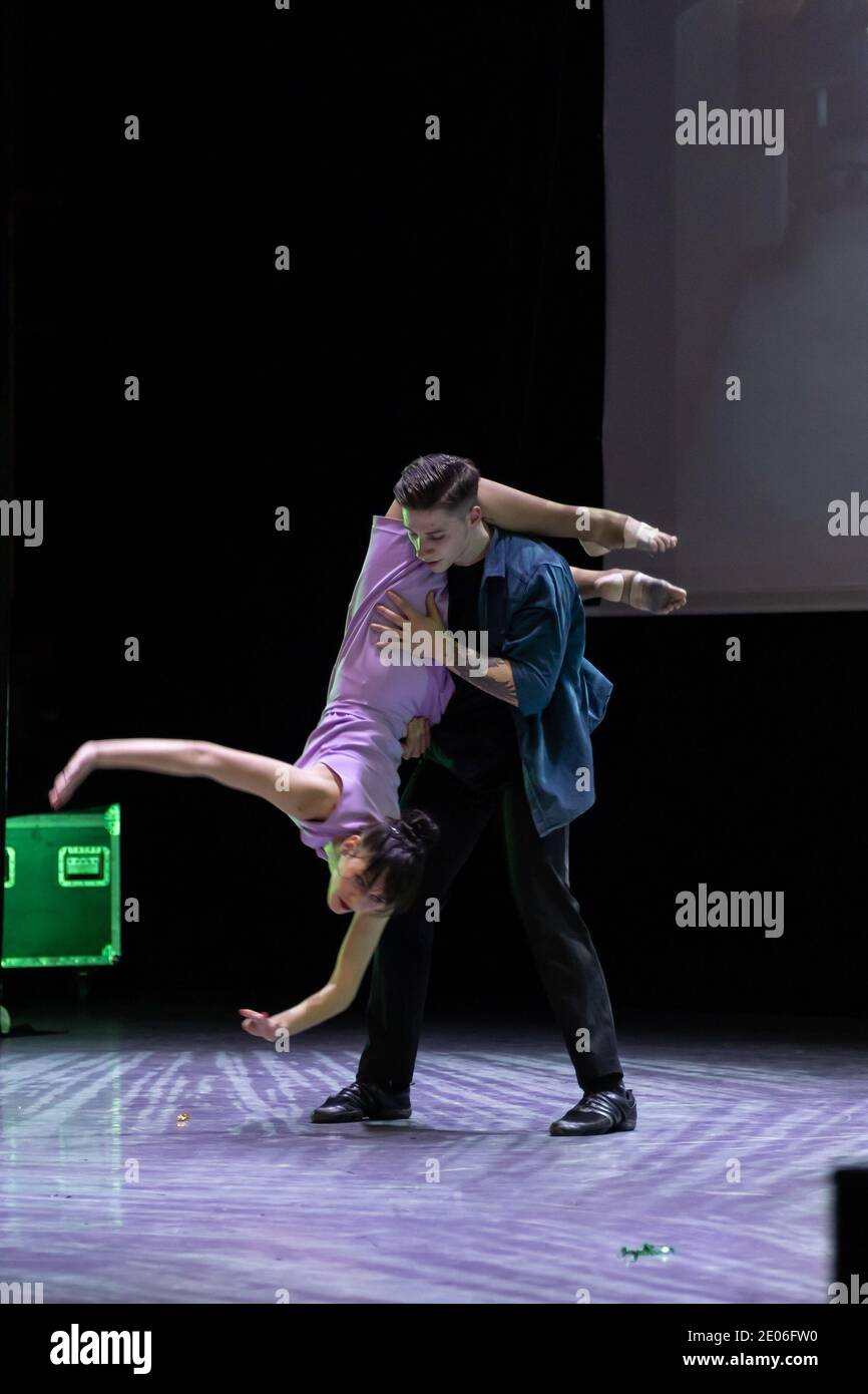 Team Actors dancers perform in the theater on stage in a retro musical ...