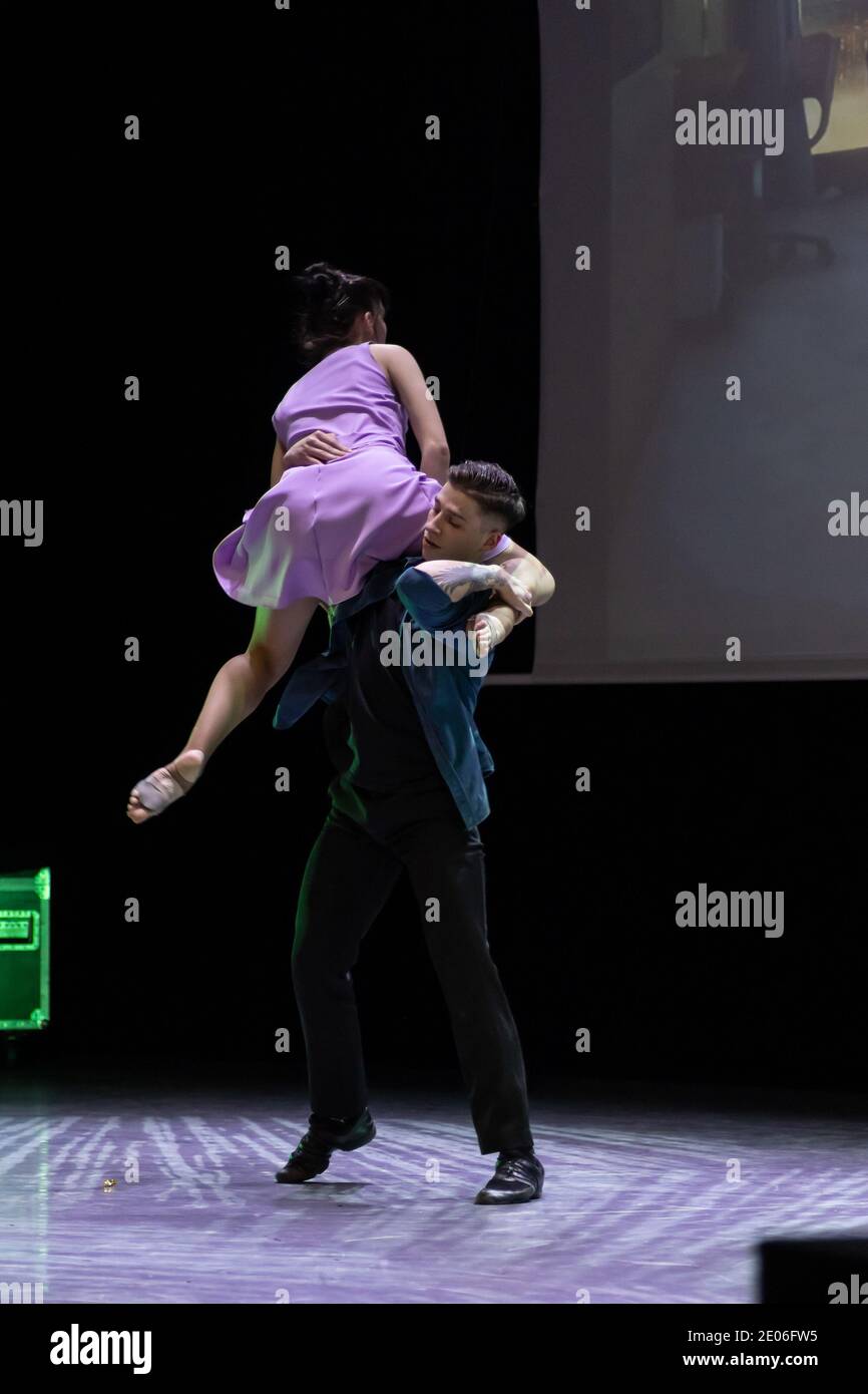 Team Actors dancers perform in the theater on stage in a retro musical ...