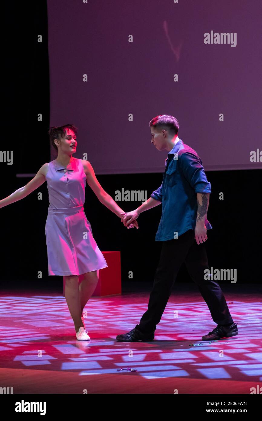 Team Actors dancers perform in the theater on stage in a retro musical ...