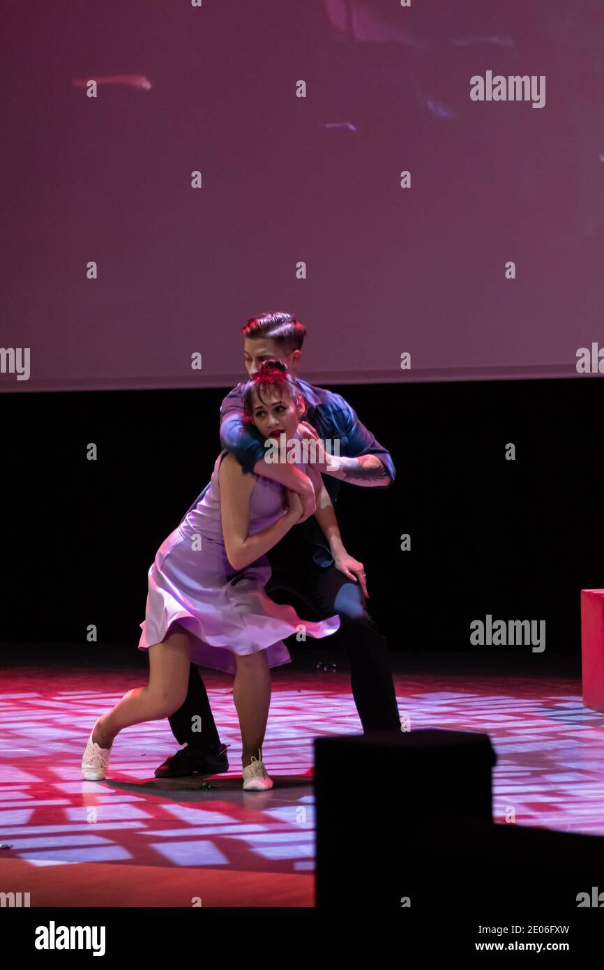 Team Actors dancers perform in the theater on stage in a retro musical ...