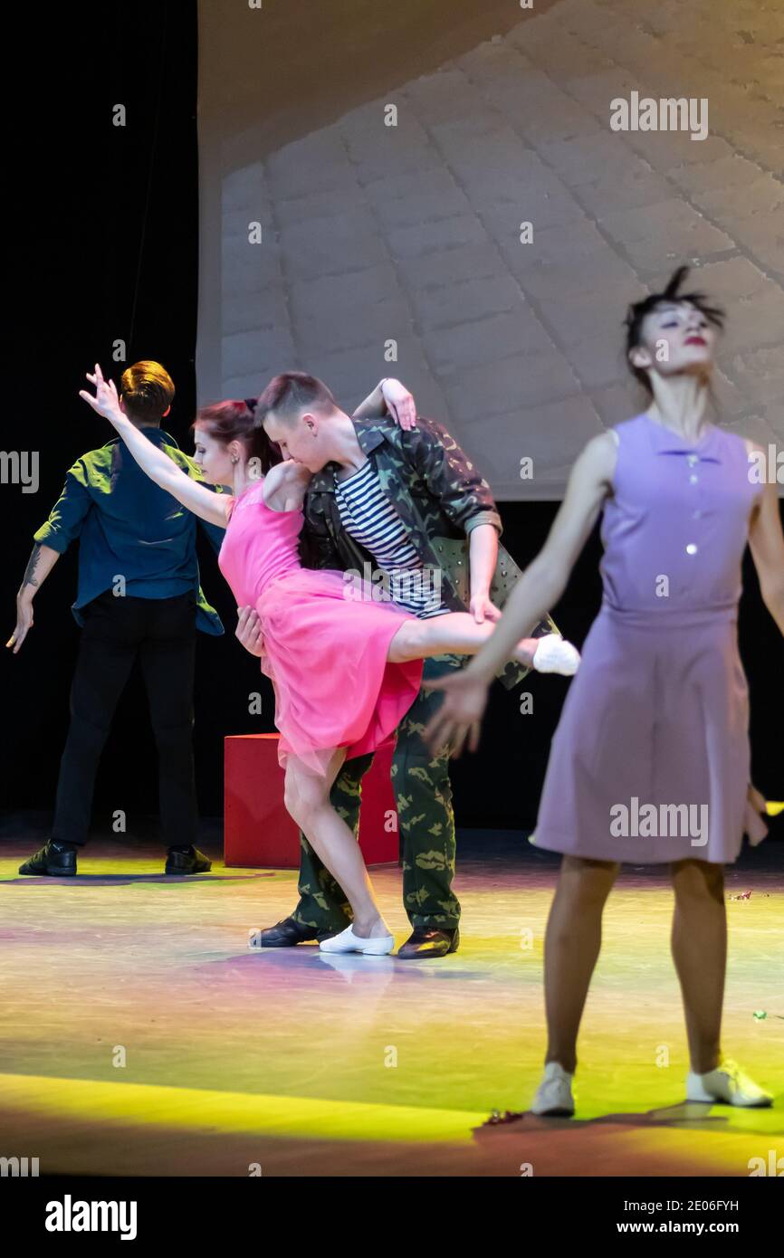 Team Actors dancers perform in the theater on stage in a retro musical ...
